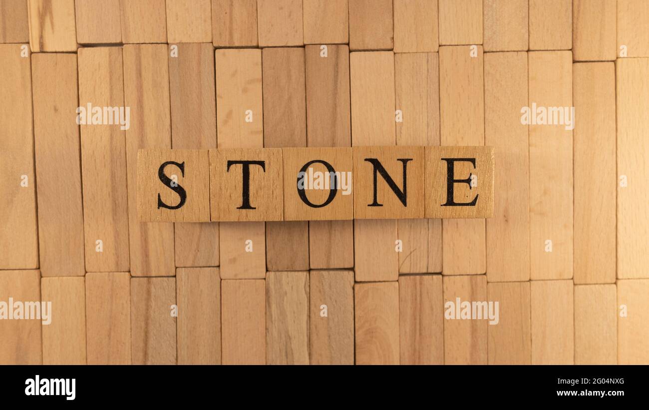 The word stone created from wooden cubes Stock Photo - Alamy