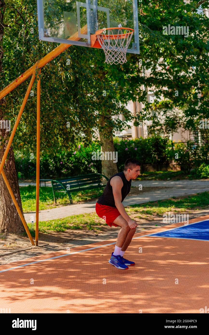 Basketball player jump shooting and playing basketball Stock Photo - Alamy