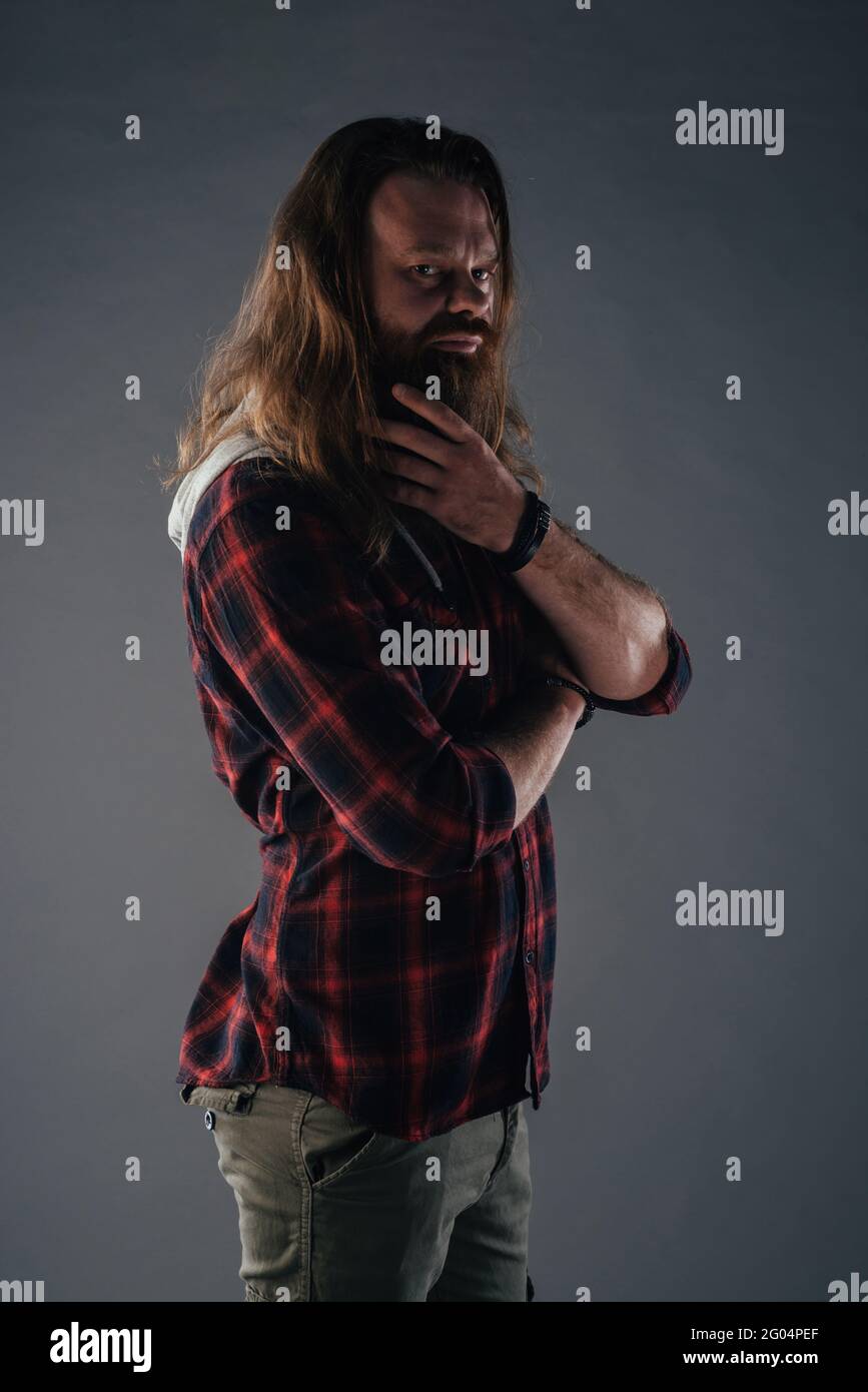 Beautiful strong nordic man with stylish hairstyle and beard on a ...