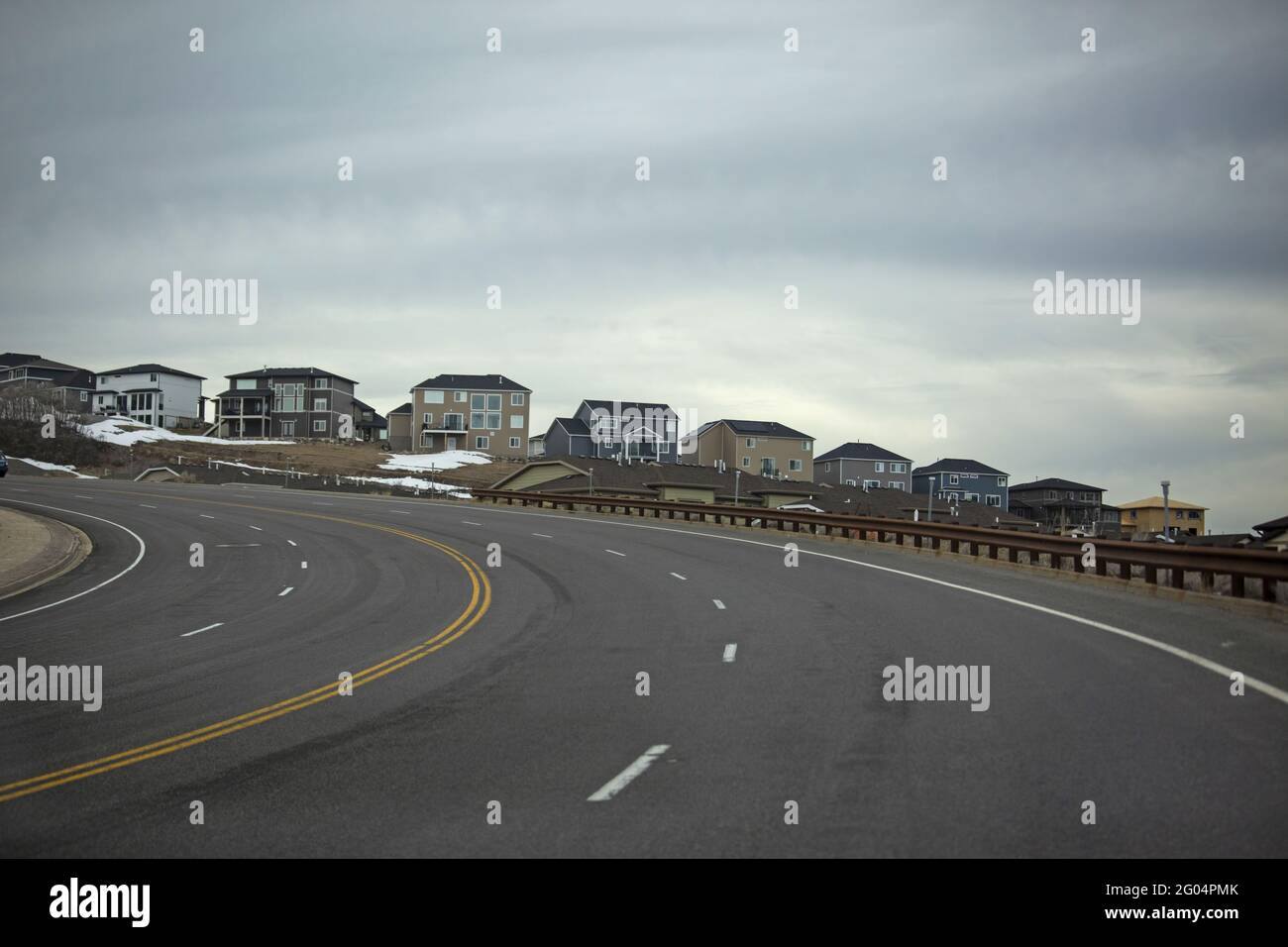 Shot of the circular-shaped car road leading to the houses shown in the ...
