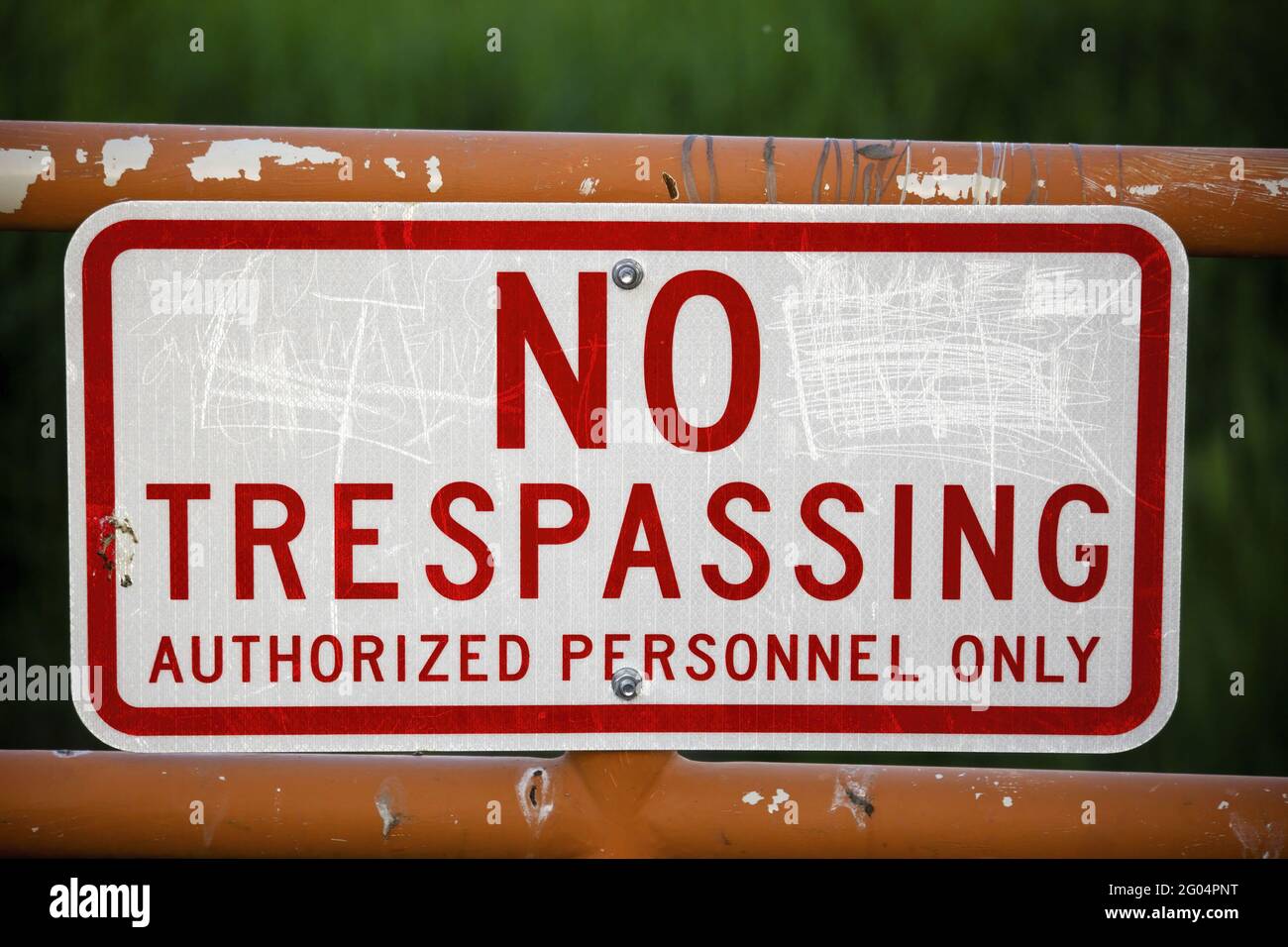 Shot of a sign declaring no trespassing as the area is for authorized ...