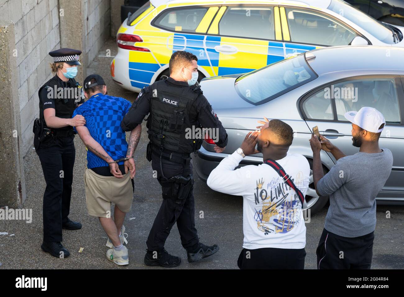Outside Margate lighthouse bar's car park, Kent police take a man in ...