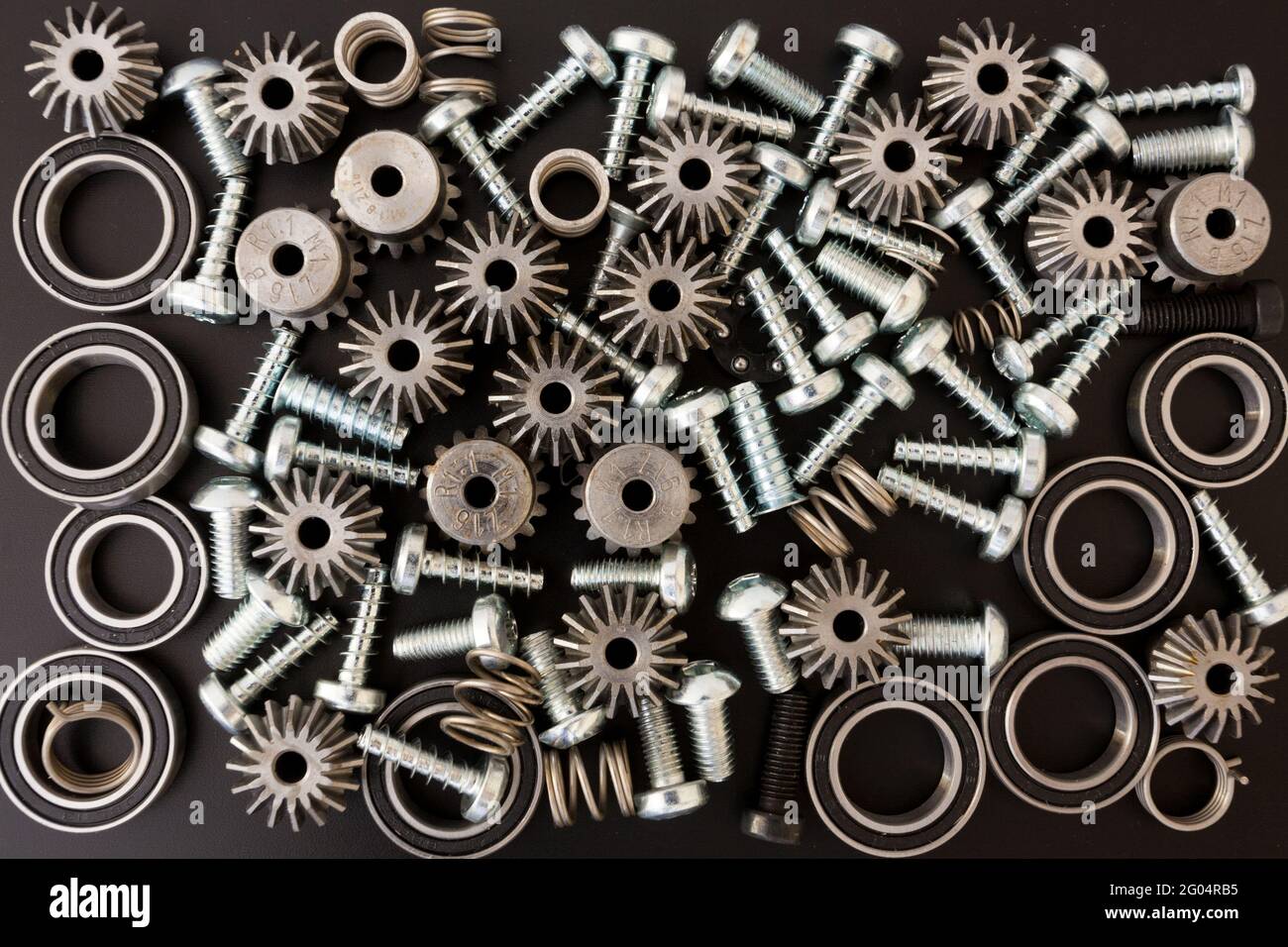 Background with mechanical components, gears, springs, screws ...