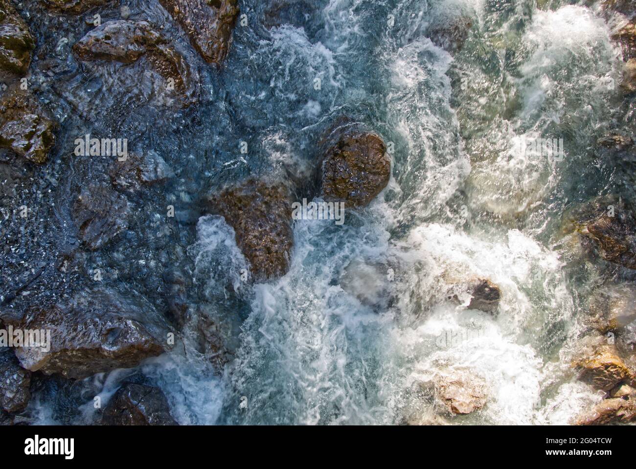 Raging water of a shallow river in Austria Stock Photo - Alamy