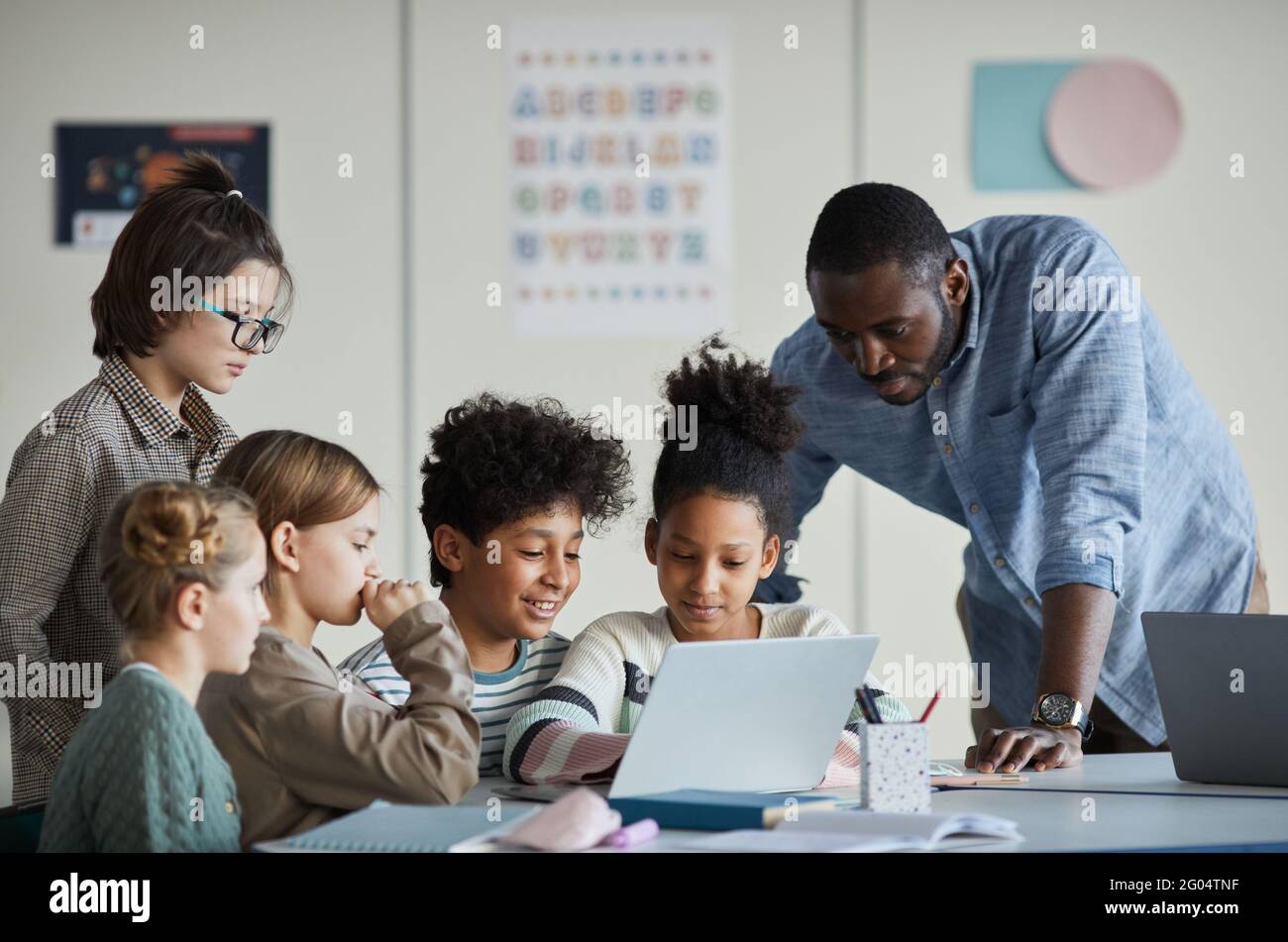 Teacher student sitting together digital hi-res stock photography and ...