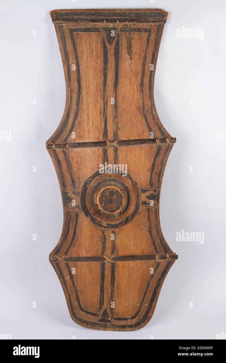 Vertical shot of a ceremonial wooden shield used by African tribes ...