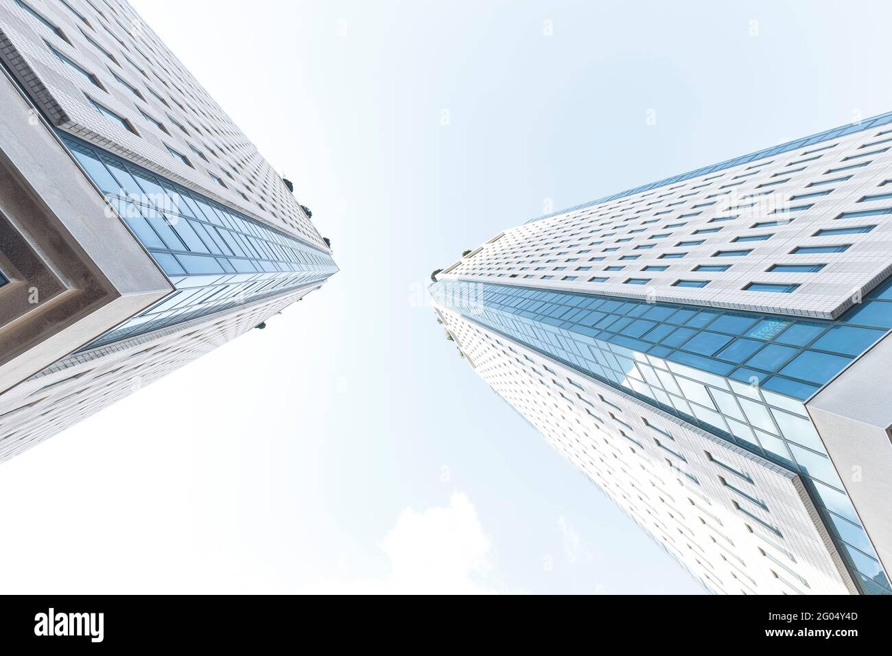 Low angle view of tall buildings against a blue sky Stock Photo - Alamy