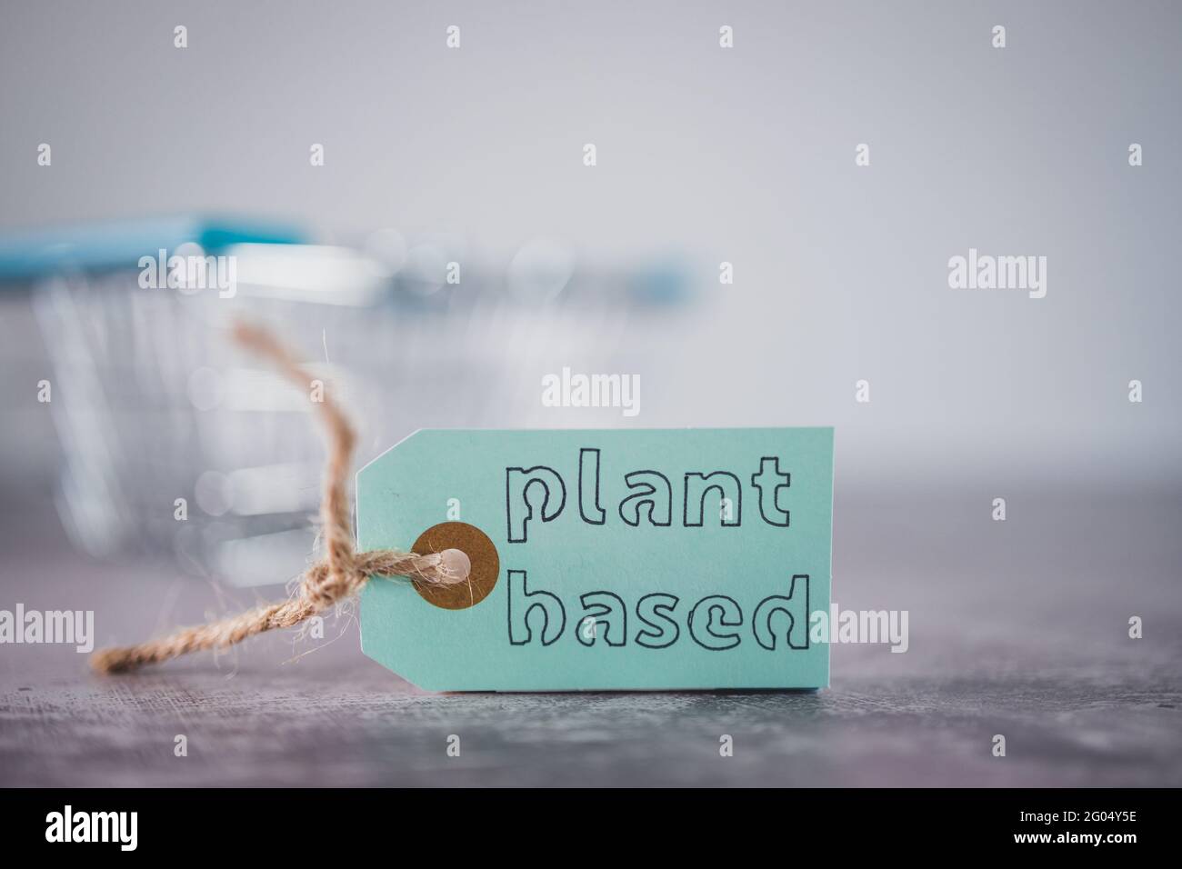 plant-based product tag with grocery shopping basket, concept of ...