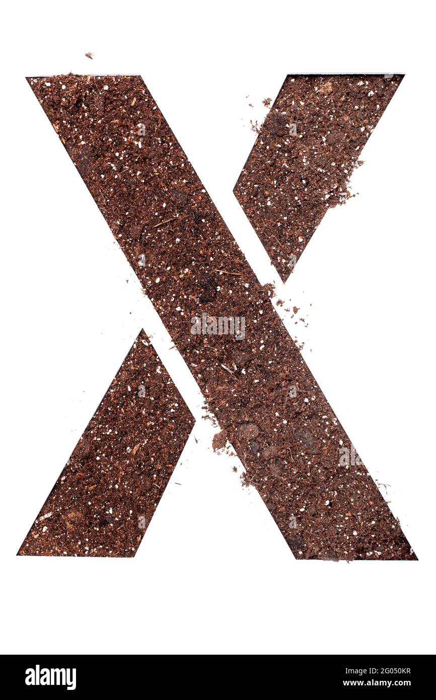 stencil letter X made above dirt on white surface Stock Photo - Alamy