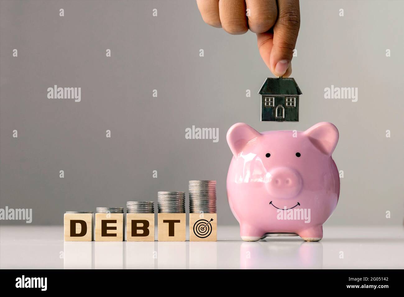 Concept of debt and financial goals.Coin on stacked wooden blocks ...