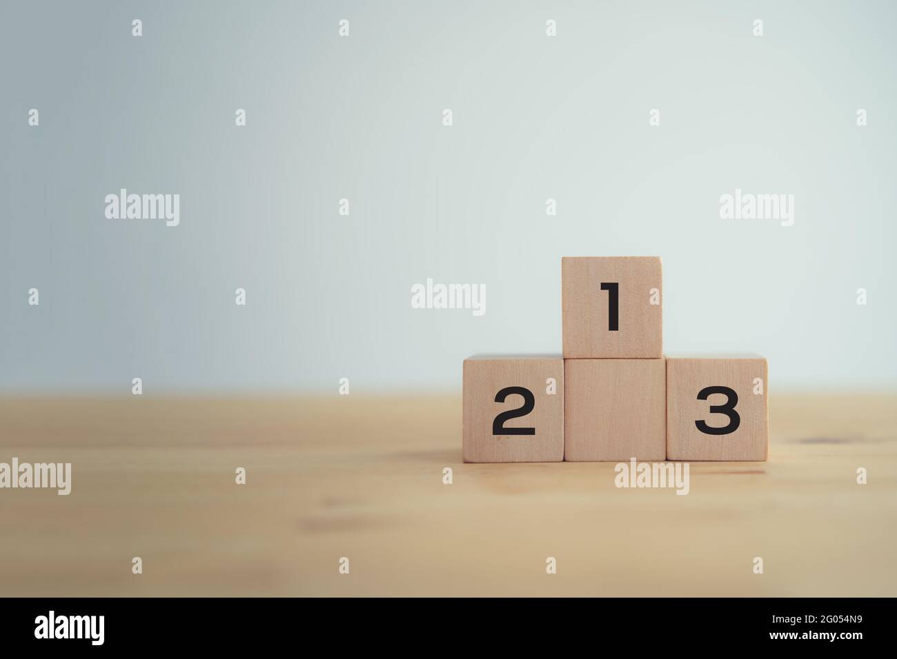 Wooden blocks stacking as a podium on white background. Target of ...