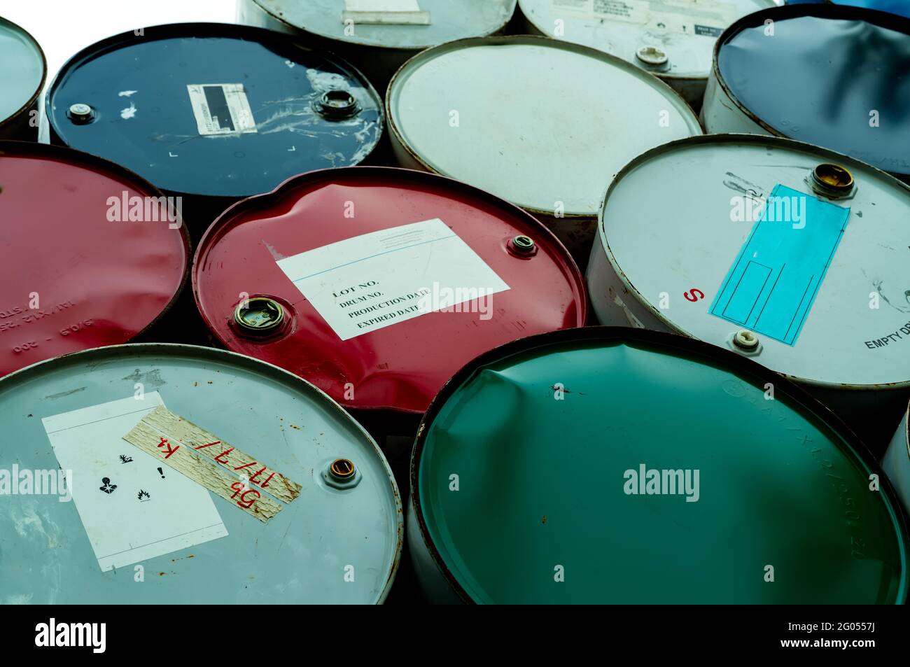 Old chemical barrels. Blue, green, and red oil drum. Steel oil tank ...