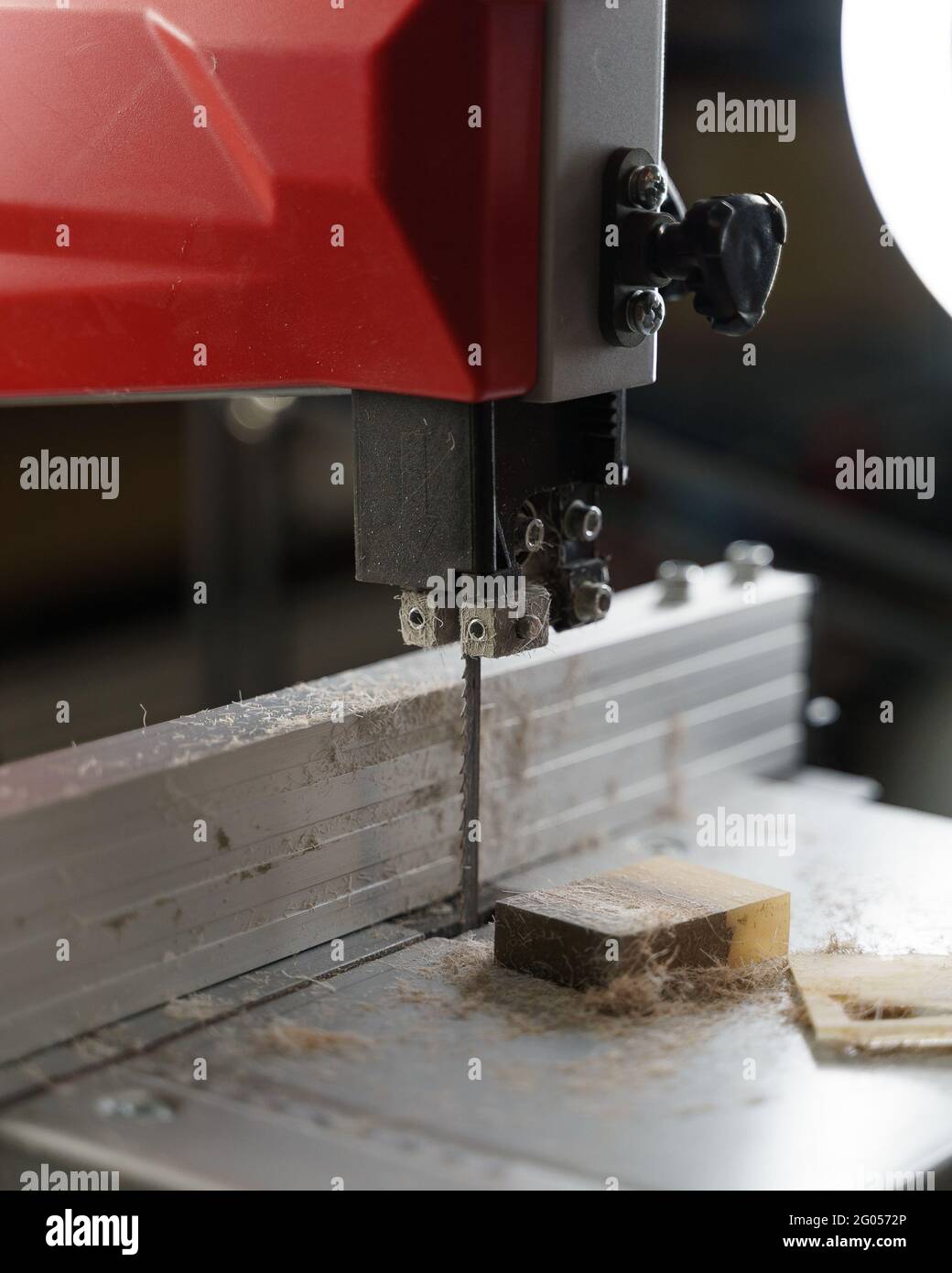 Vertical shot of a band saw drilling machine Stock Photo - Alamy