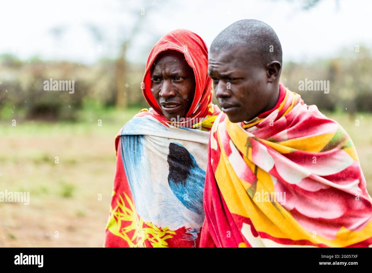 Two Massai men walking together Stock Photo - Alamy