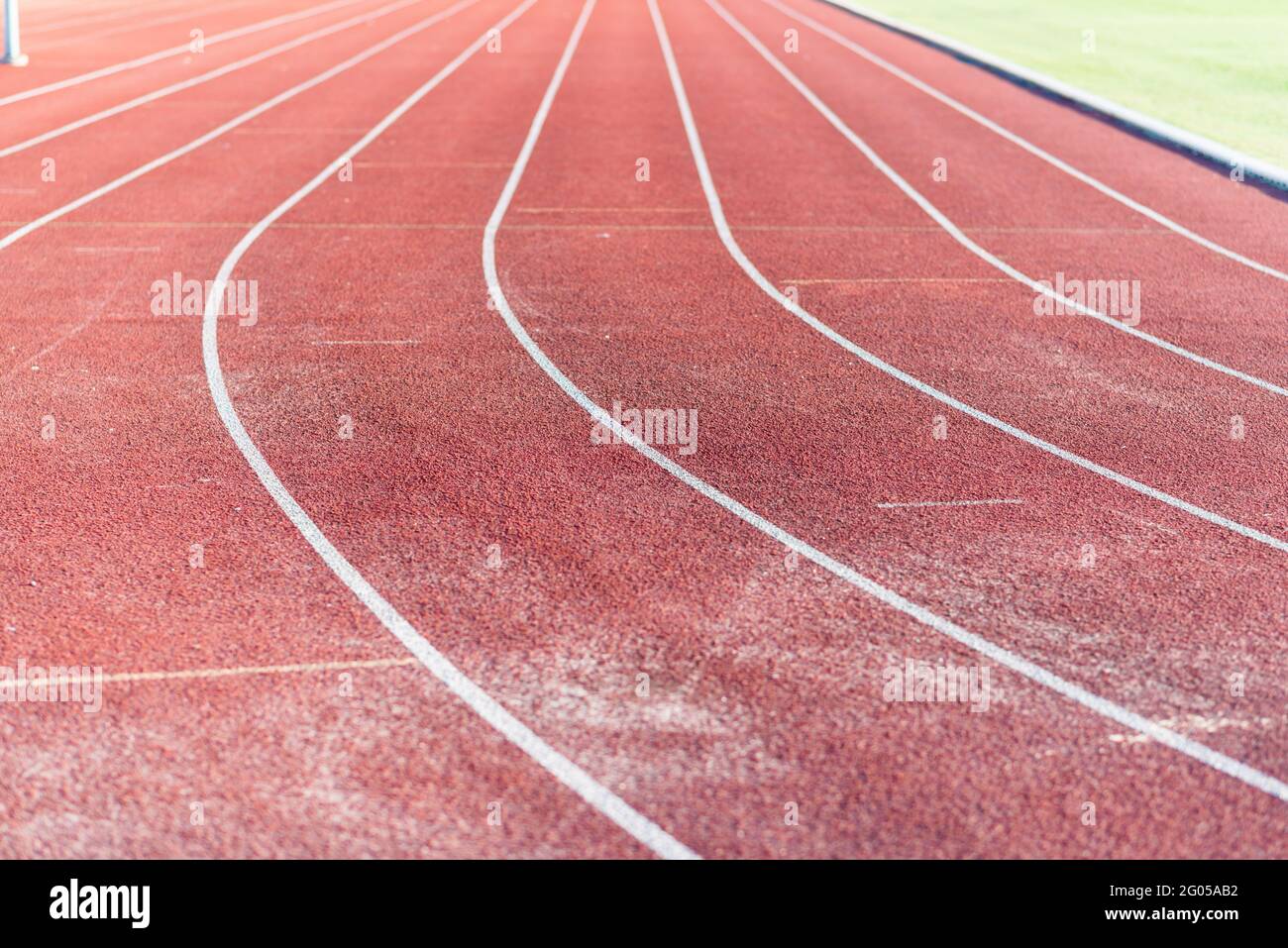 Part Red plastic track in the outdoor track and field stadium.Closeup ...