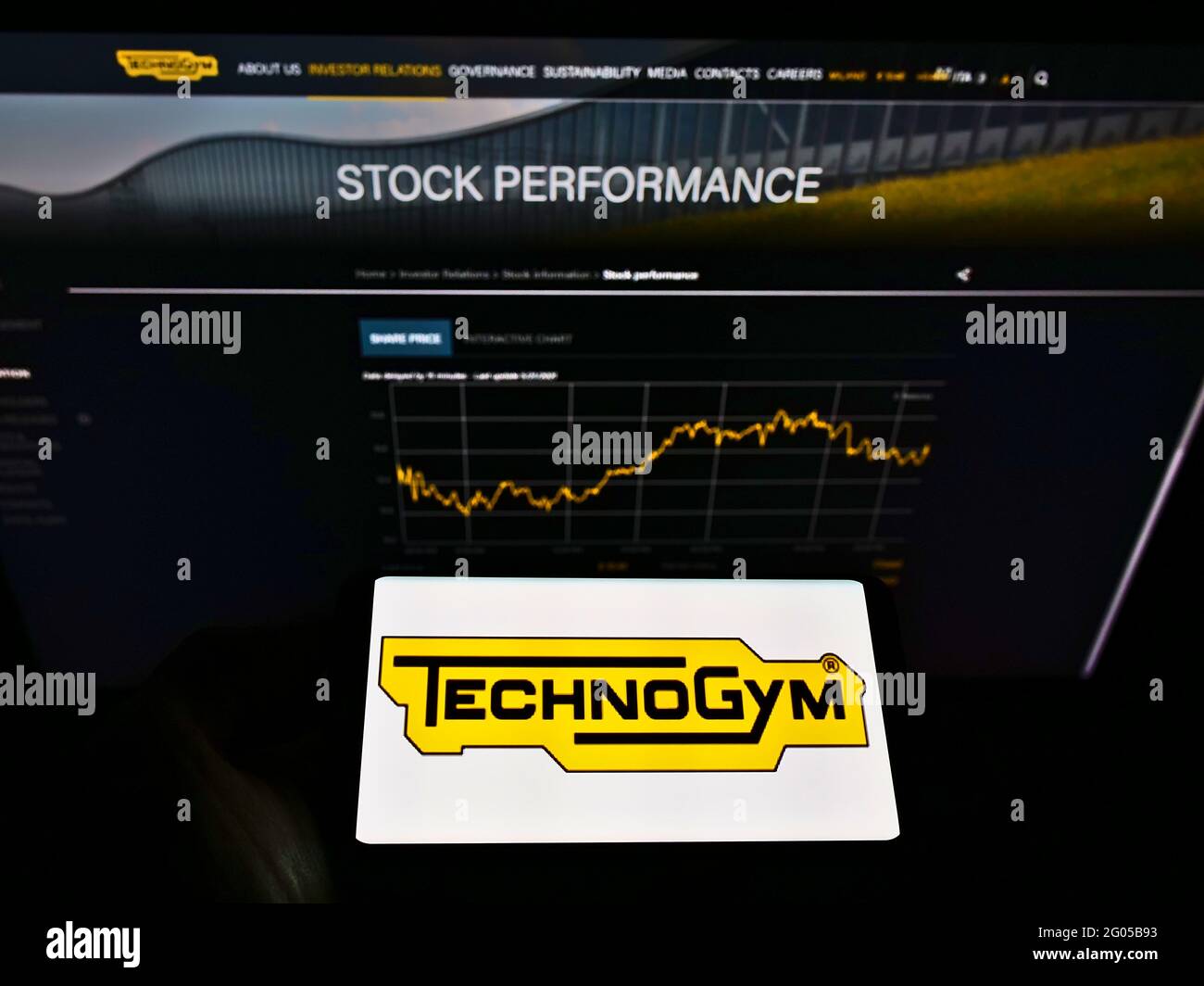 Person holding smartphone with logo of Italian fitness equipment ...