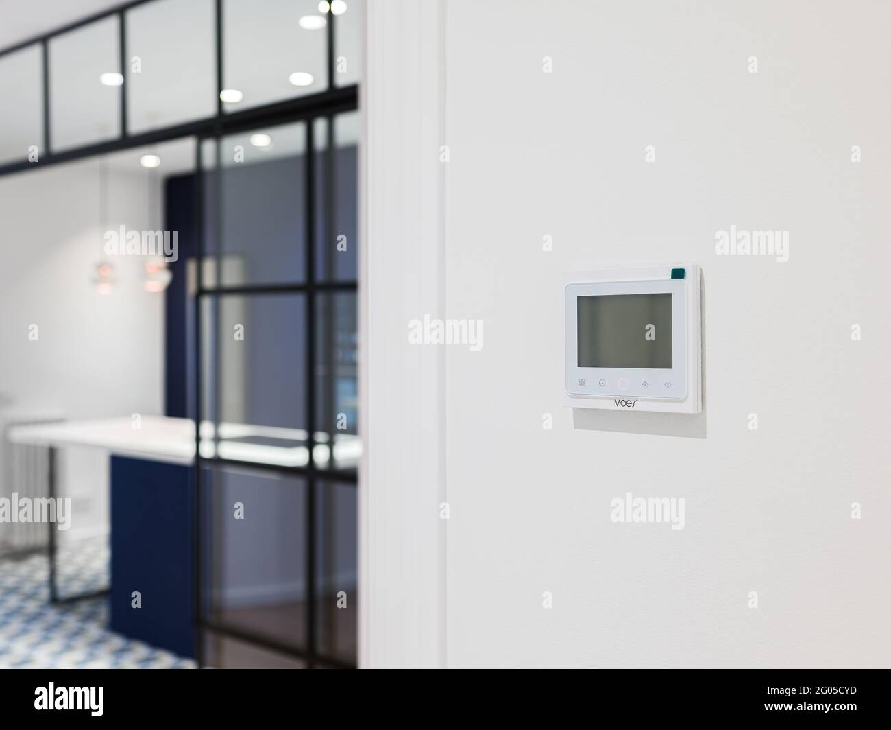 Console for controlling heating and cooling on the white wall in modern ...