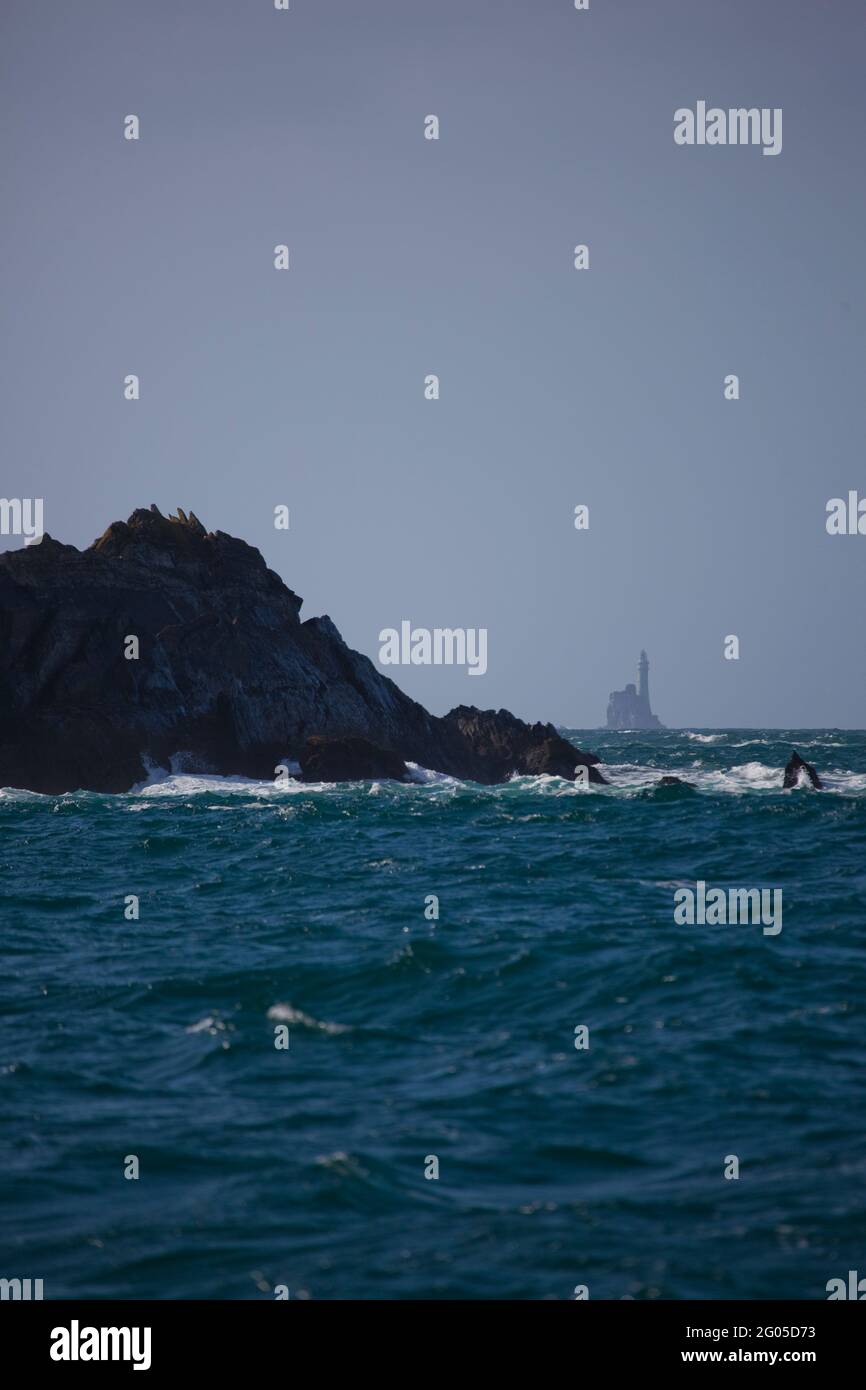 Fastnet lighthouse, as seen from the rocks of Cape Clear Island ...