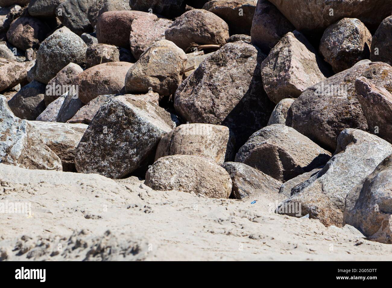 Rockfall on the road in the mountains. Stones of different sizes ...