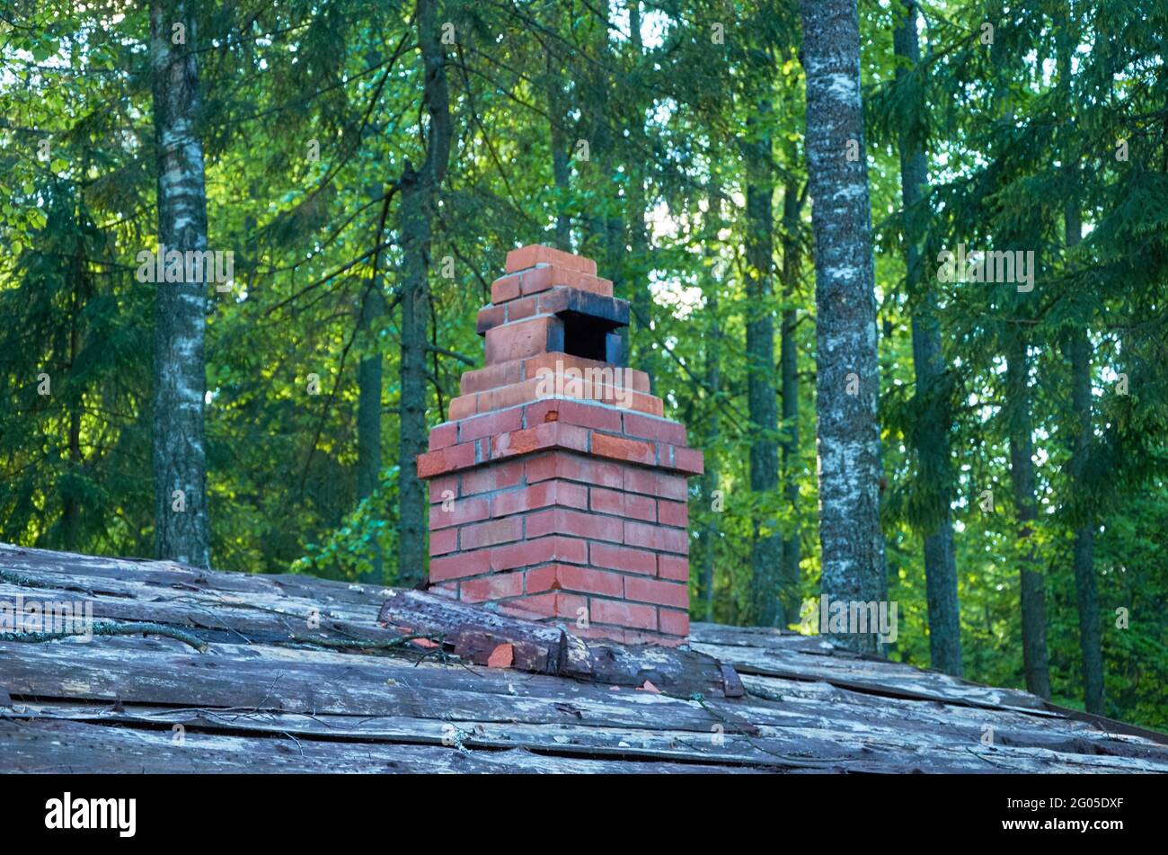 The roof of a wooden dugout with a brick chimney Stock Photo - Alamy