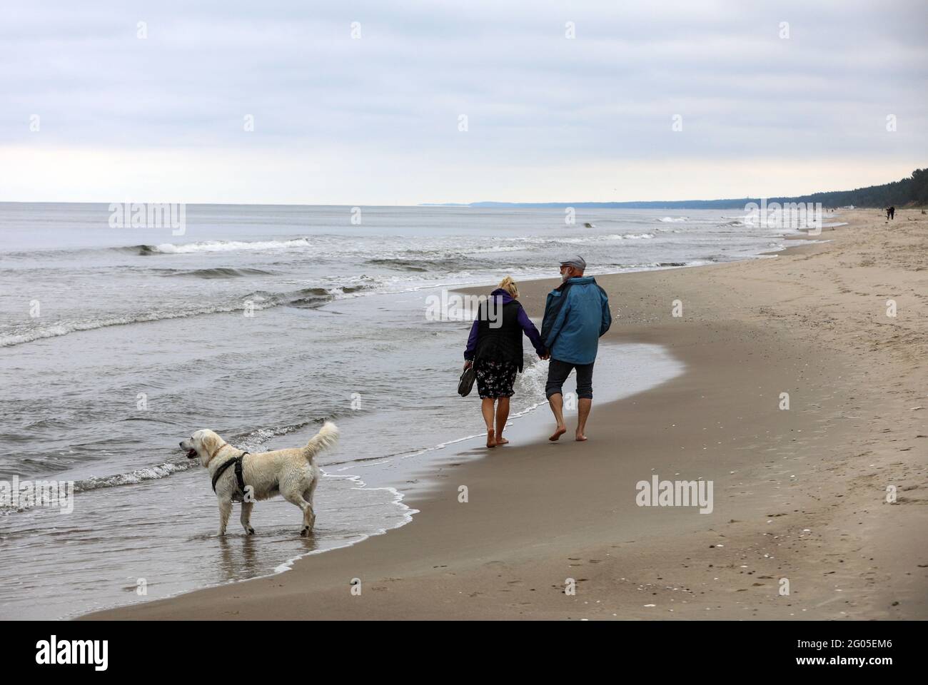 Active and healthy lifestyle. Walking on a sandy beach sea shore Stock ...