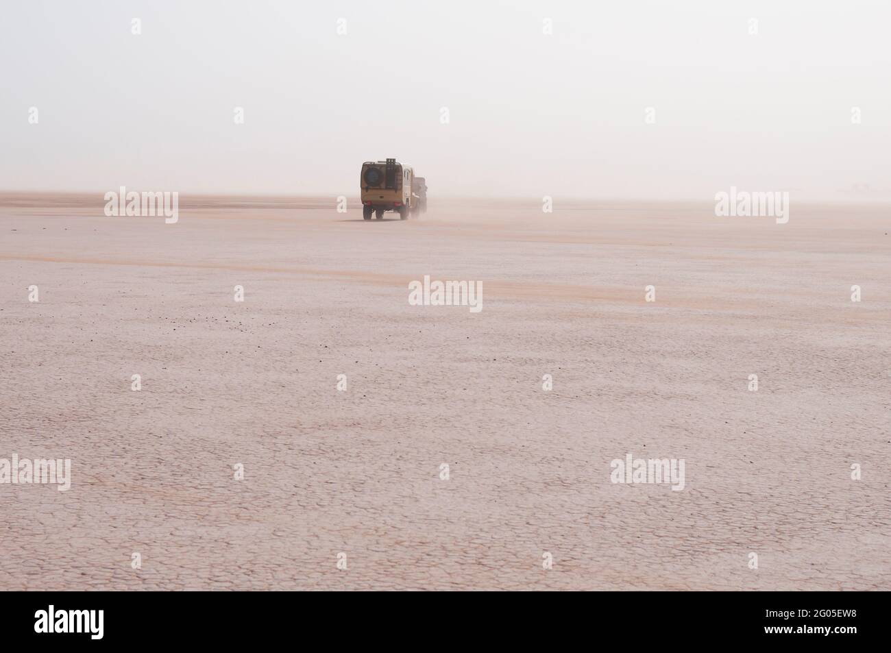 Off-road vehicle drive in the sandstorm in the Sahara, on the Lac Iriki ...