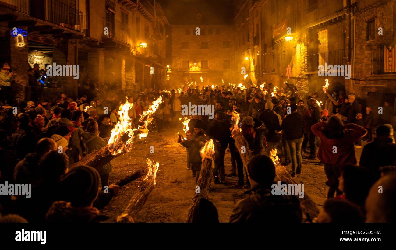 Dances around the fire in the Galceran de Pinós square, in Bagà during ...