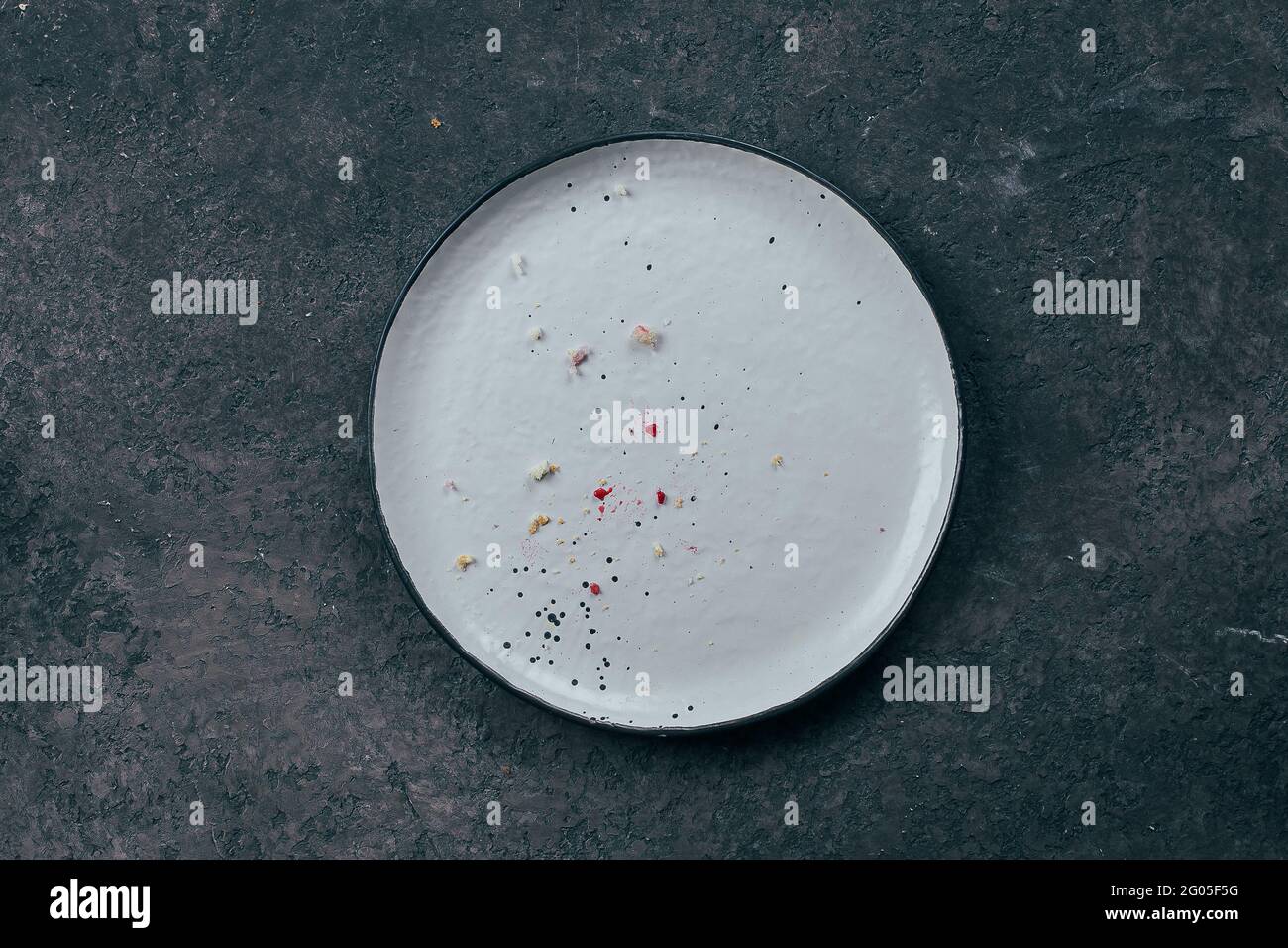 The concept of the end of celebration. Empty plate with crumbs after ...