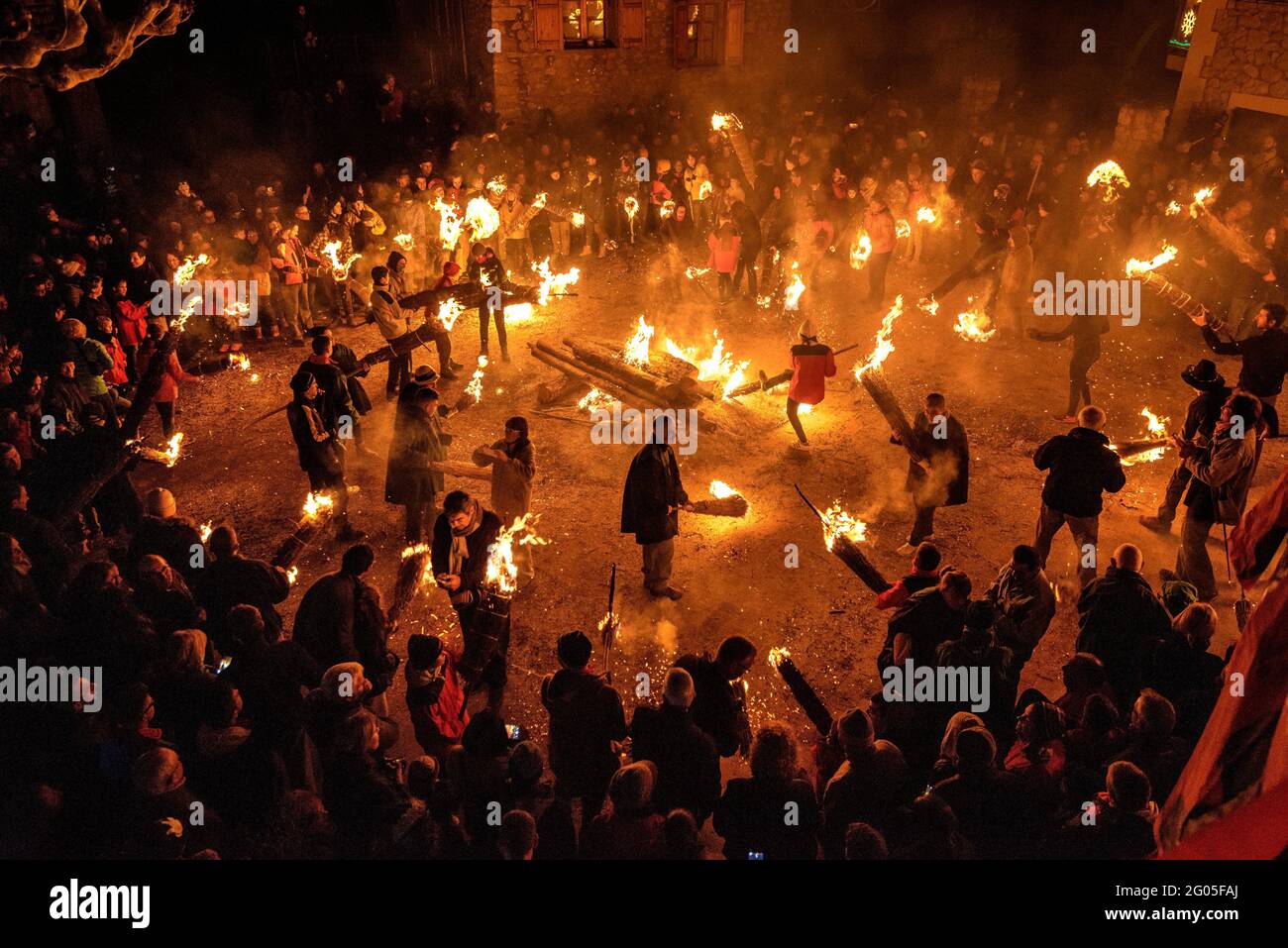 Dances around the fire in the Sant Julià de Cerdanyola Church square ...