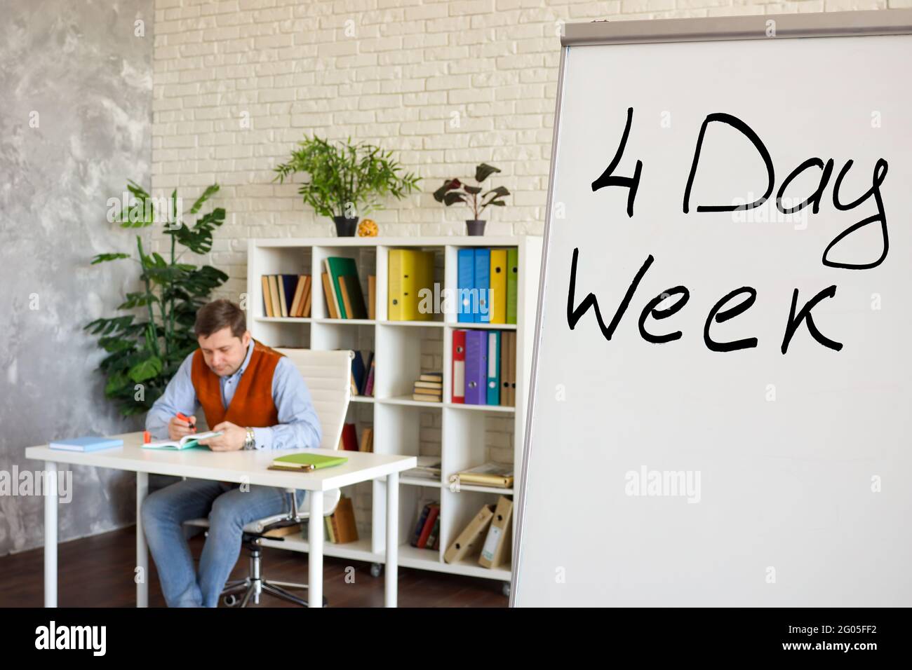 Sign Four day week for work in the office on the whiteboard Stock Photo ...