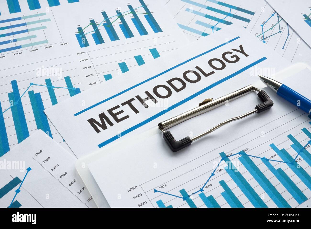 Stack of papers with data and word methodology Stock Photo - Alamy