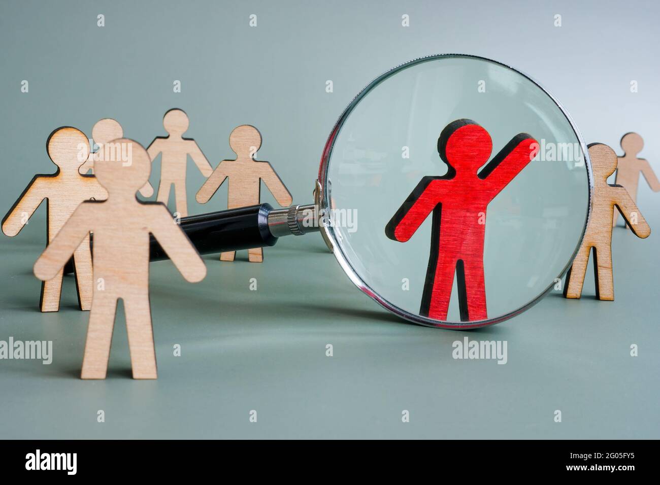 Be unique concept. Talent management with magnifying glass and ...