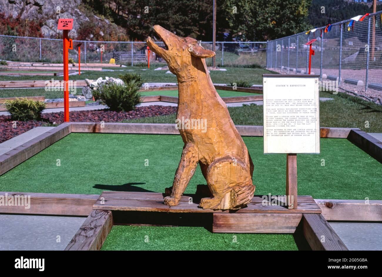 1980s America - Golden West mini golf, coyote, straight on, Hill City ...