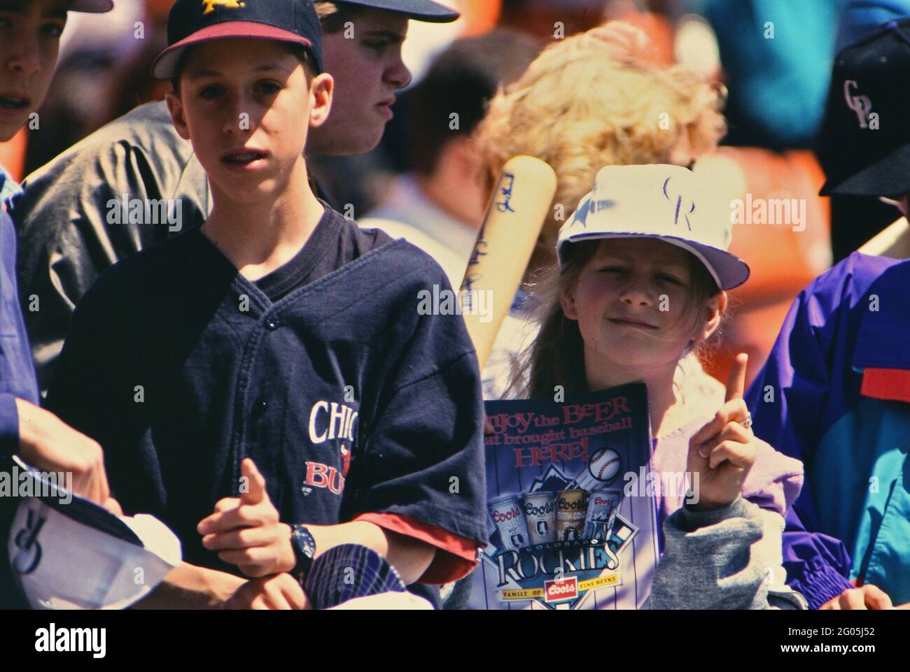 Young baseball fans in the stands of a ballpark-- Please credit ...