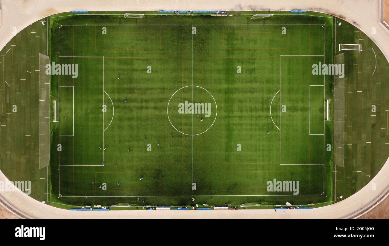 Aerial view of a football stadium with players on the field Stock Photo ...