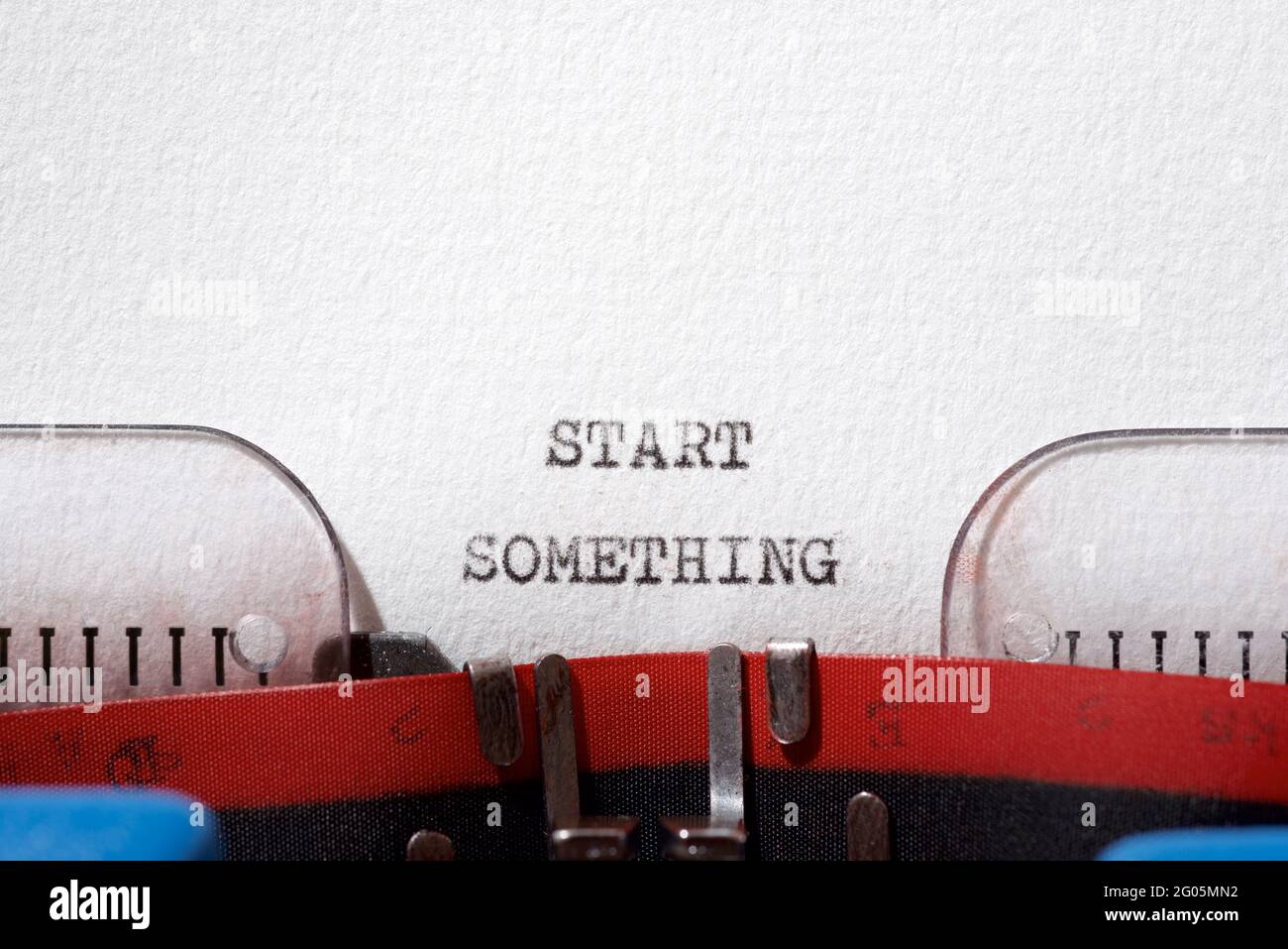 Start something phrase written with a typewriter Stock Photo - Alamy