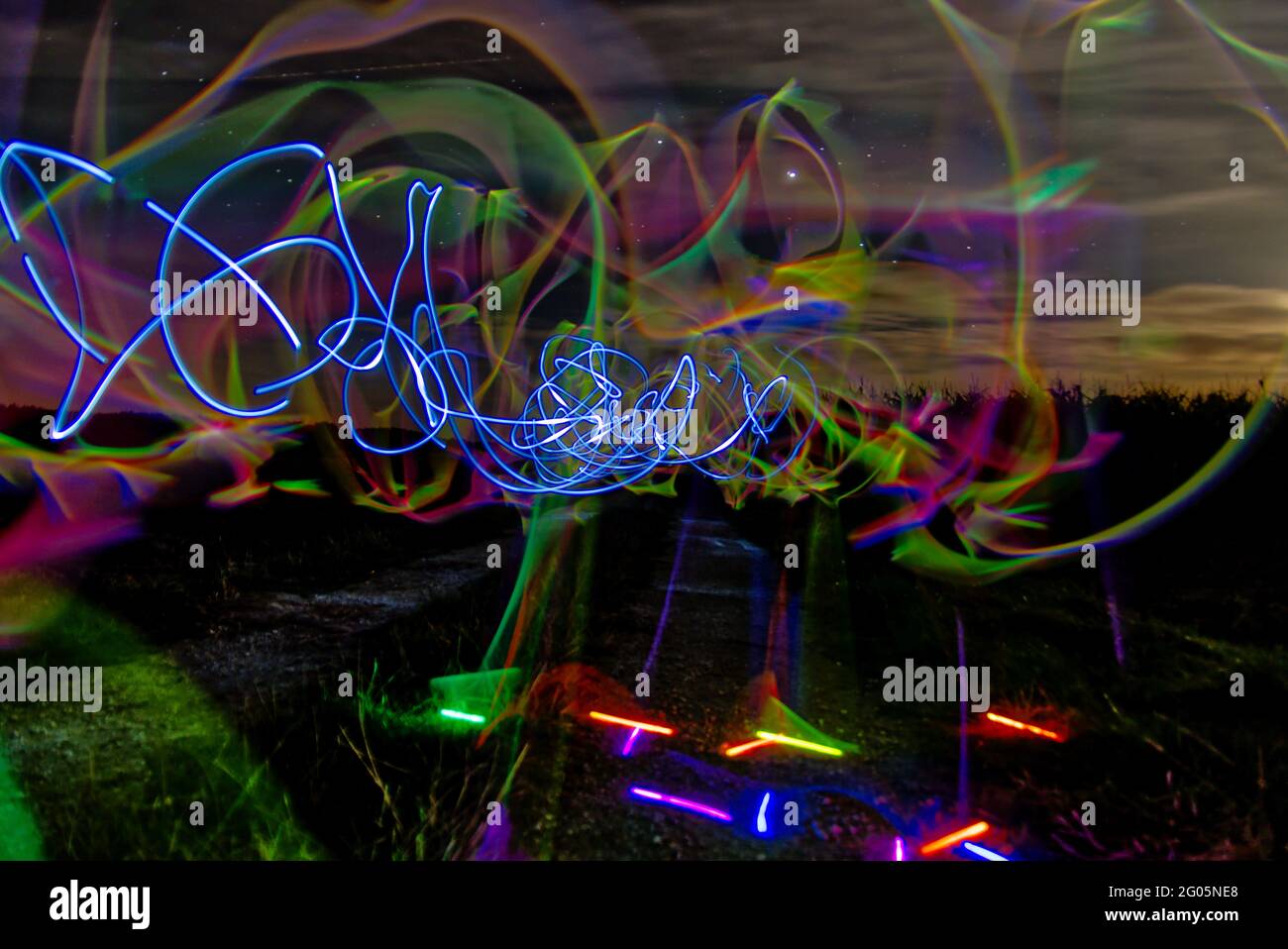 Neon light drawing for wallpaper and background Stock Photo - Alamy