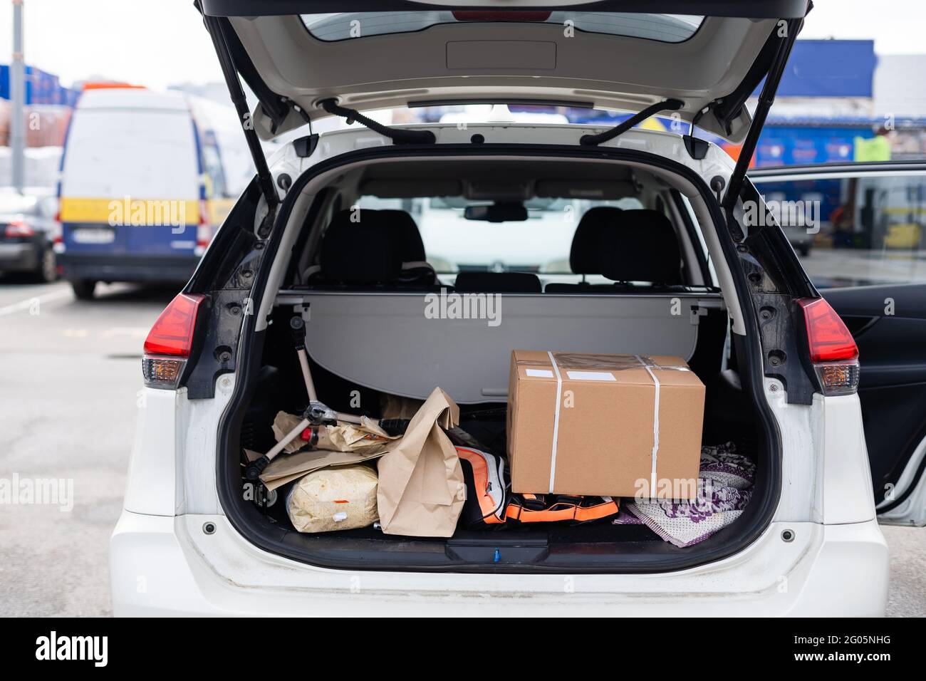 Office moving concept. Cartoon boxes in a car trunk Stock Photo - Alamy