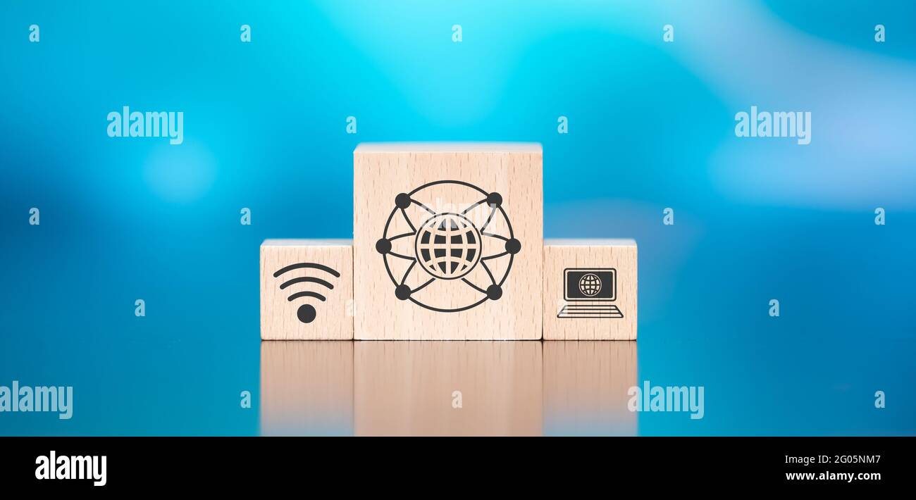 Wooden blocks with symbol of globalization concept on blue background ...