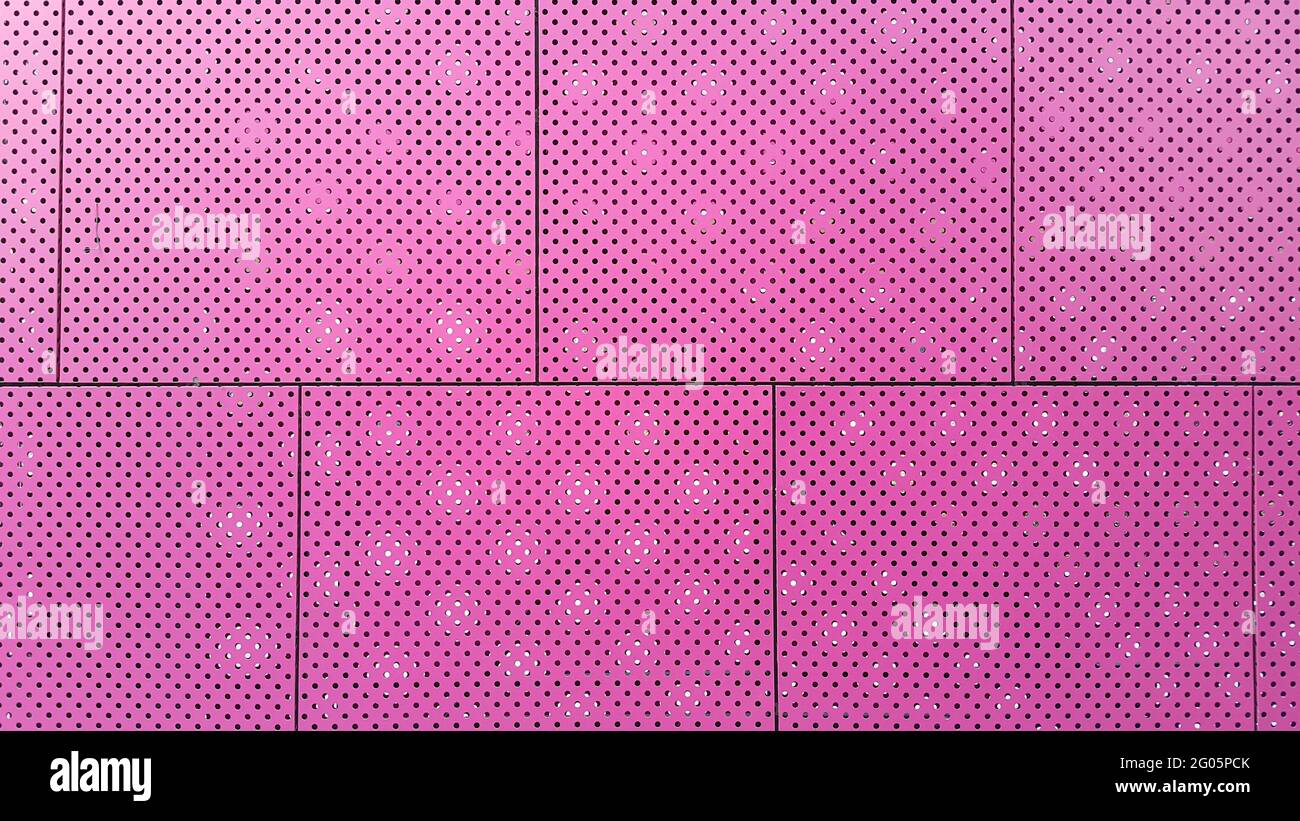 Pink sheet metal with holes background Stock Photo - Alamy