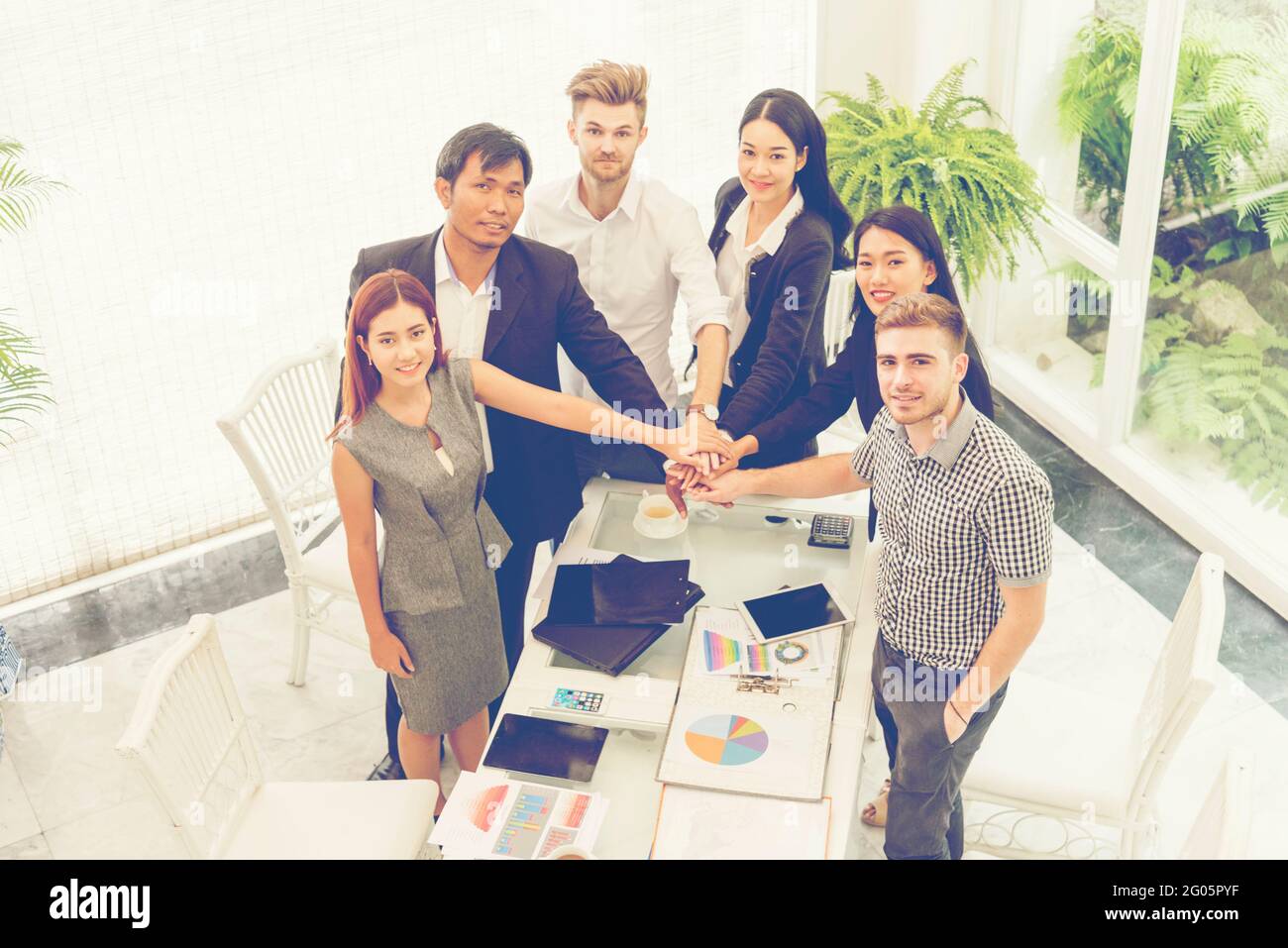 Group of diversity people with success partnership fist bump of hands together to show power and ...