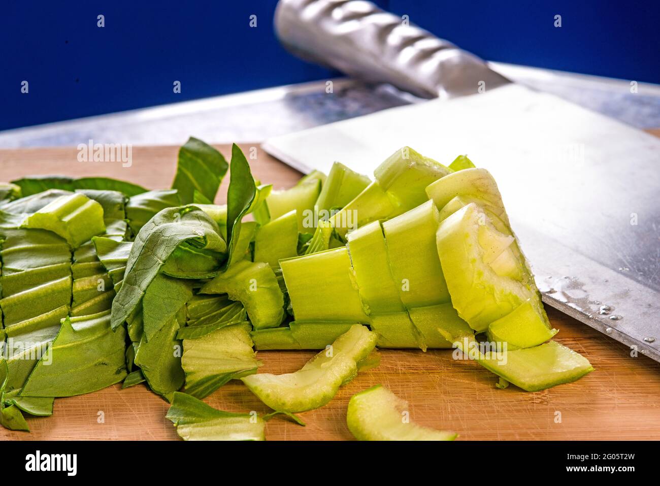 Cut Pak Choi With A Chinese Kitchen Axe Stock Photo - Alamy
