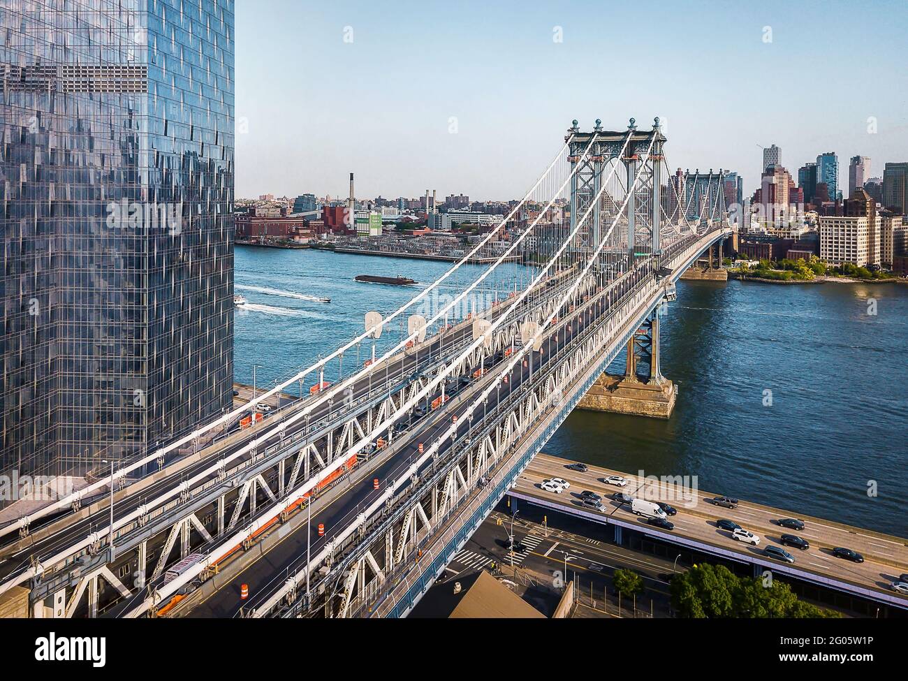 Aerial view of Manhattan bridge and downtown Brooklyn above East river ...