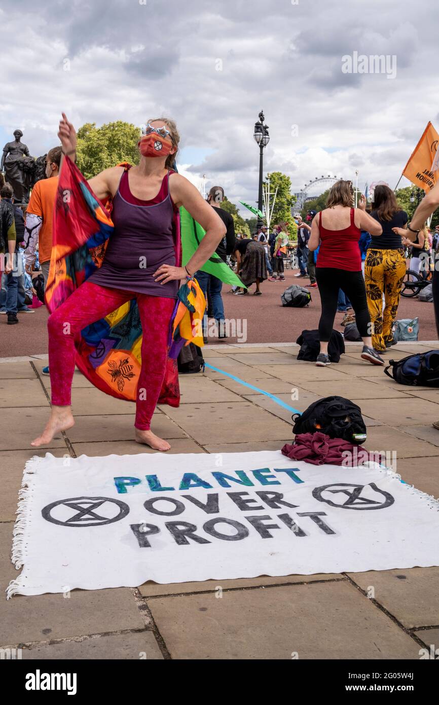 LONDON, UK - A crowd of Extinction Rebellion demonstrators dance and ...