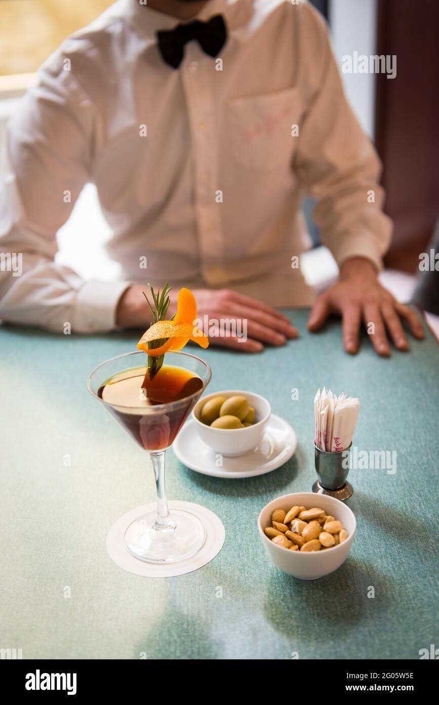 Still life of Zazou cocktail with olives and almonds at Bar Luce ...
