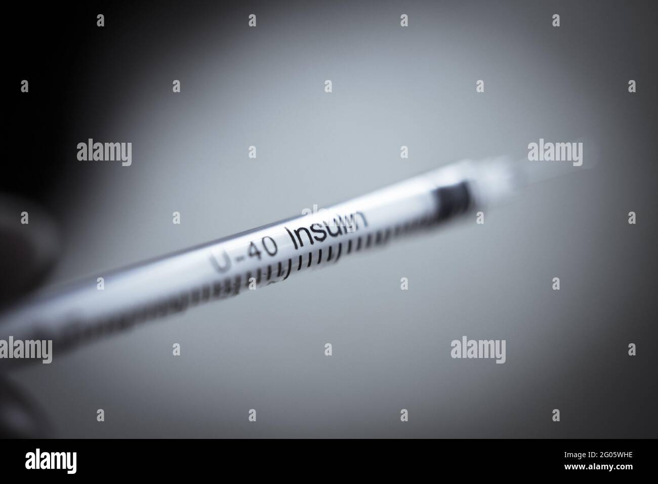 Insulin injecting syringe held by nurses hand. Copy space Stock Photo ...