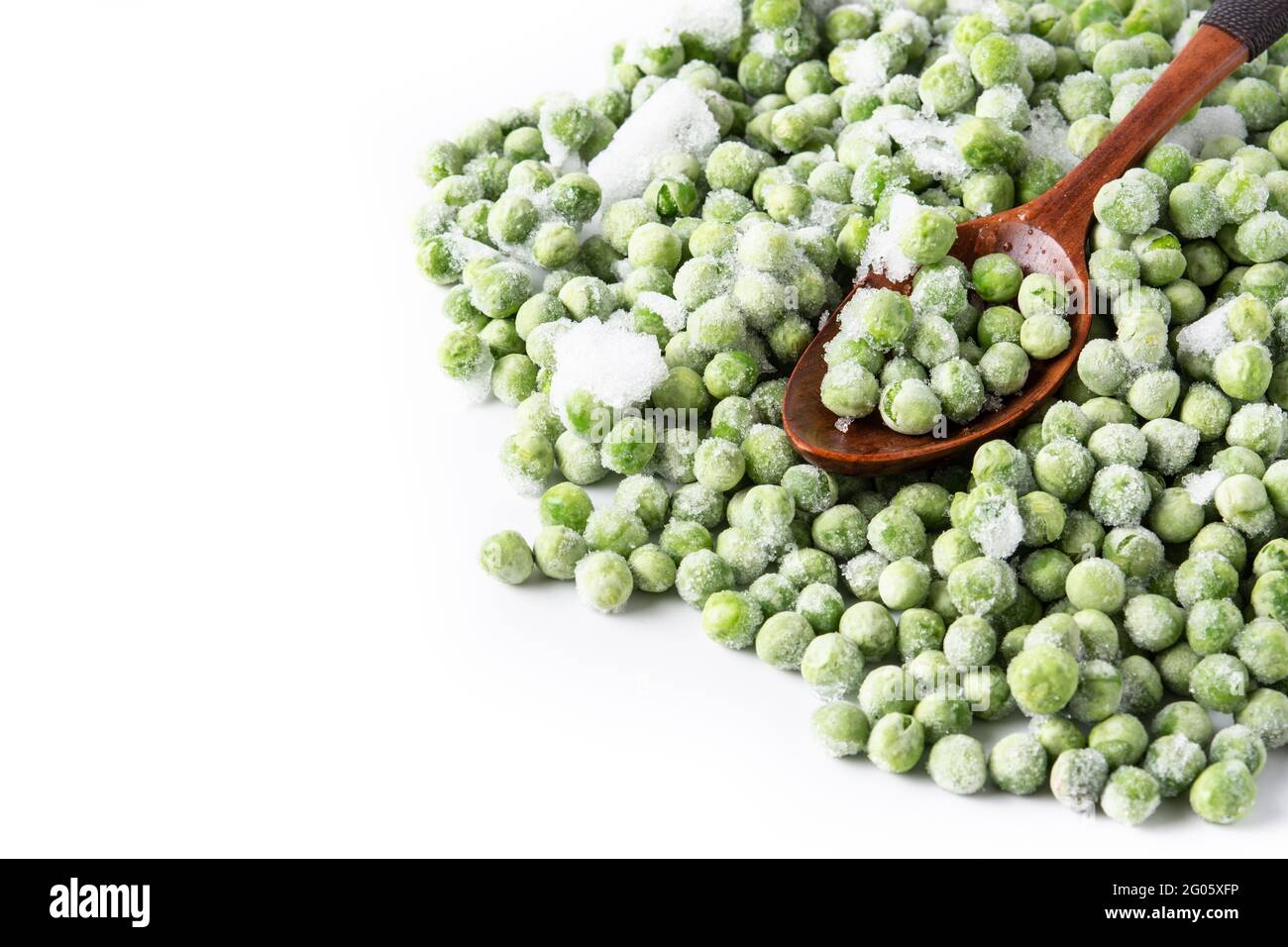 Frozen green peas isolated on white background Stock Photo - Alamy