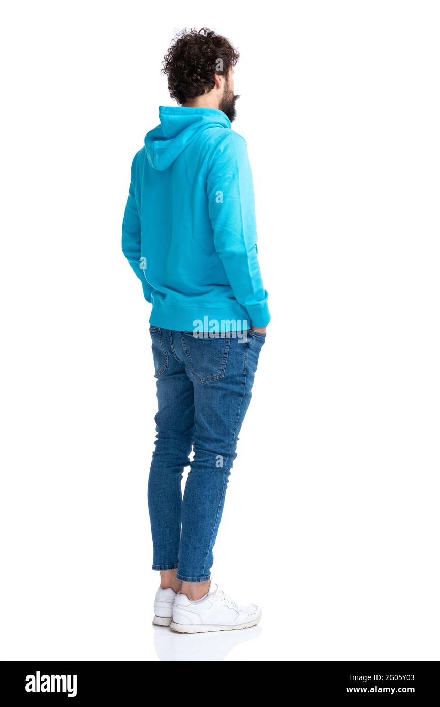 full body picture of unshaved young guy holding hands in pockets and ...
