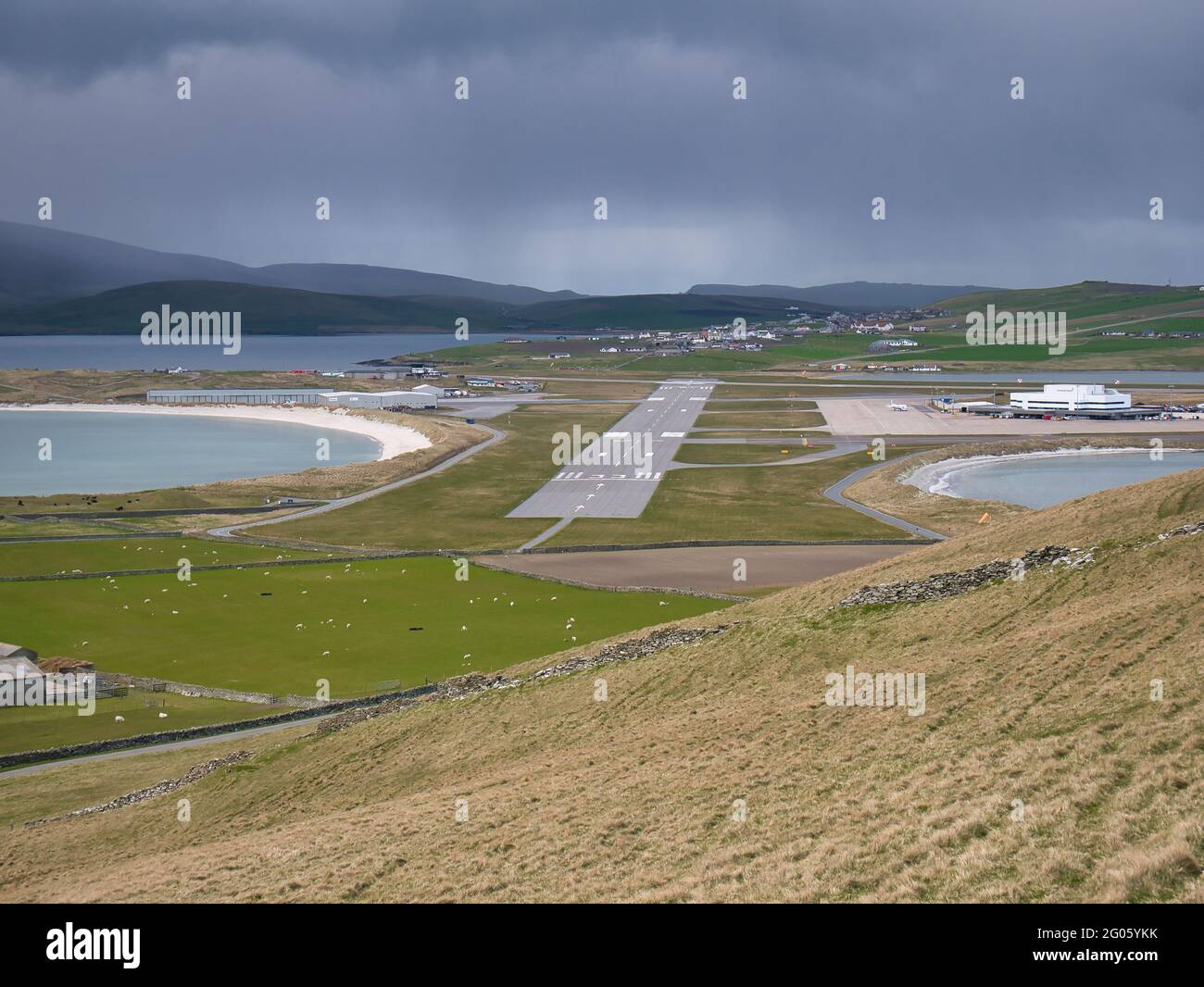 On a cloudy, overcast day, a view of Sumburgh Airport runway 15-33 ...