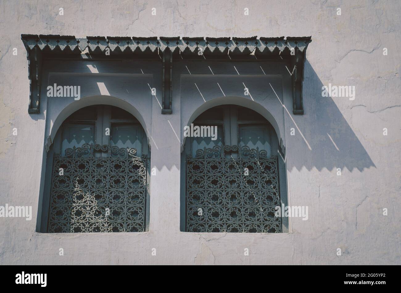 Arch windows in the shadows Stock Photo - Alamy